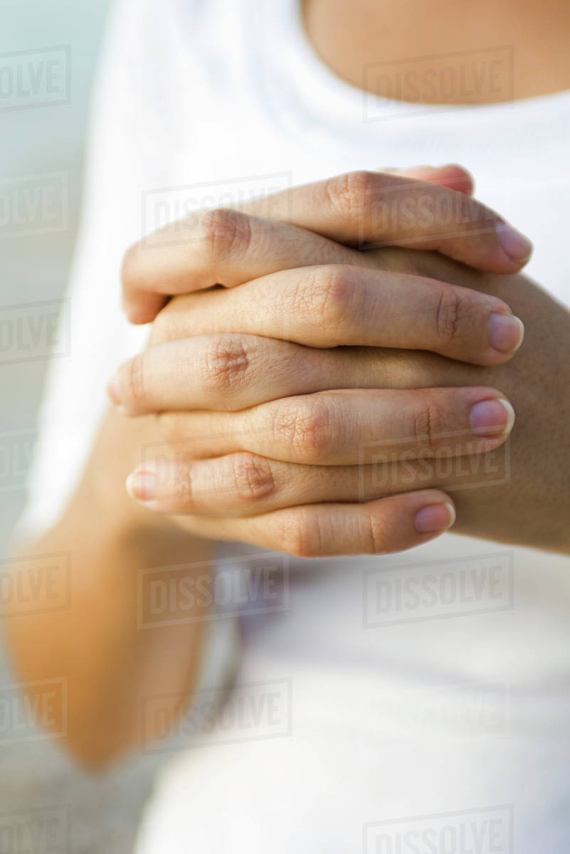 Woman's clasped hands - Royalty-free Stock Photo | Dissolve