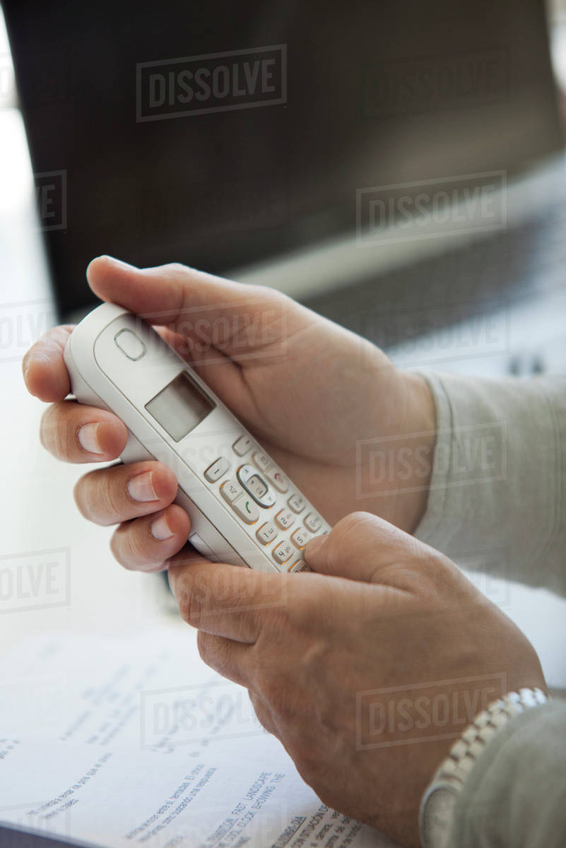 Man's hands holding cell phone, cropped - Royalty-free Stock Photo ...