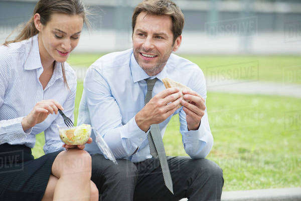 Coworkers having lunch together outdoors - Royalty-free Stock Photo ...
