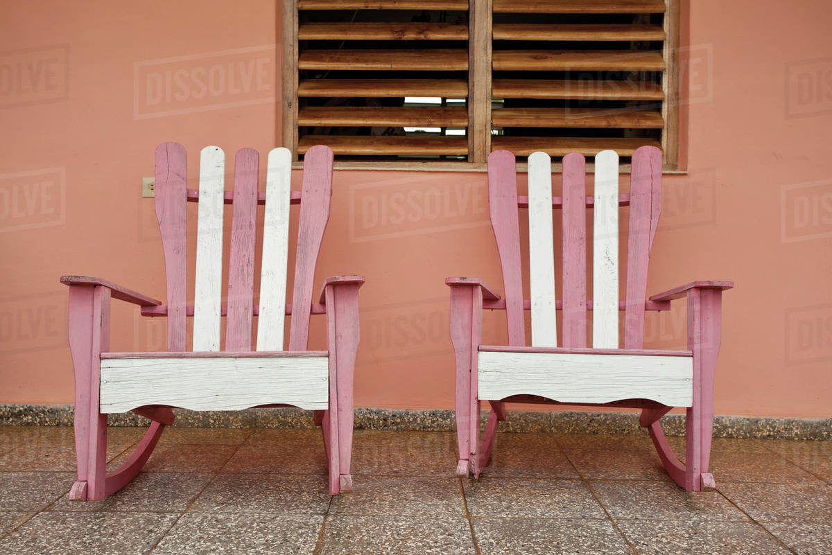 Colorful rocking chairs - Stock Photo - Dissolve