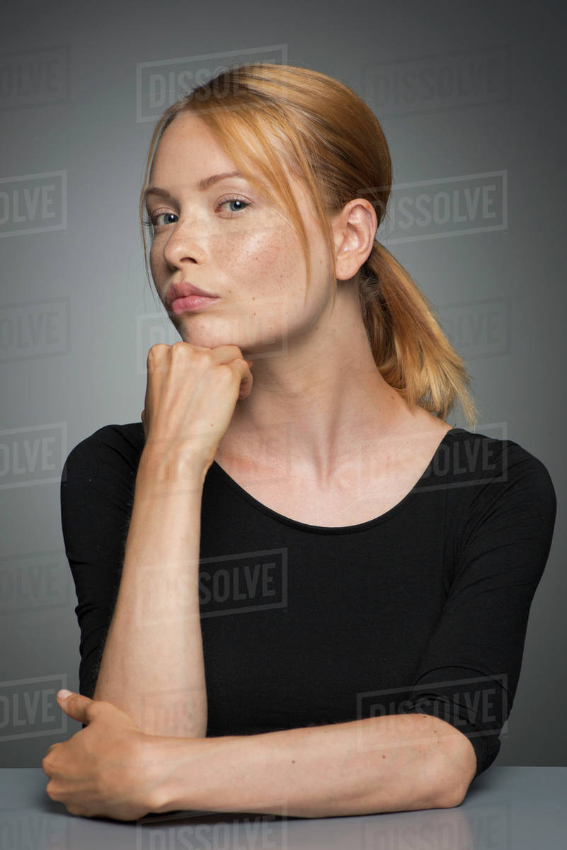 Woman sulking, portrait - Stock Photo - Dissolve