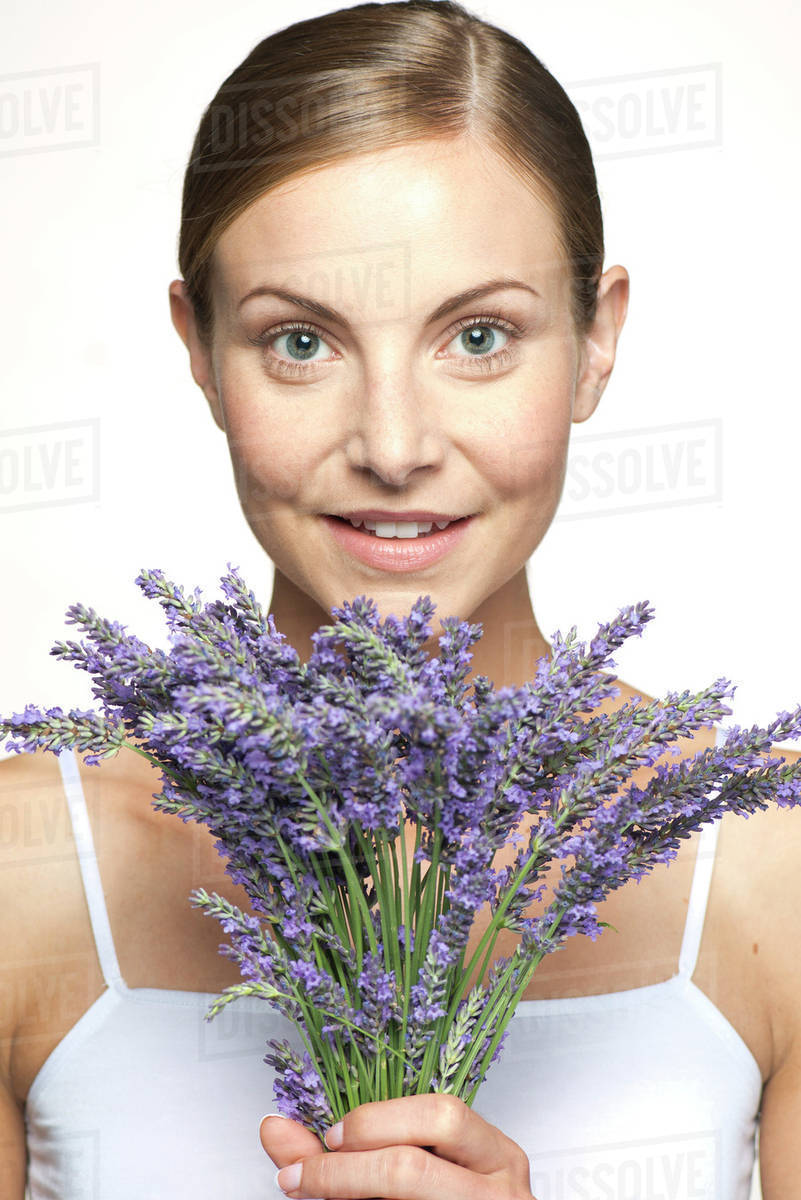 Woman holding bouquet of fresh lavender, portrait - Royalty-free Stock ...