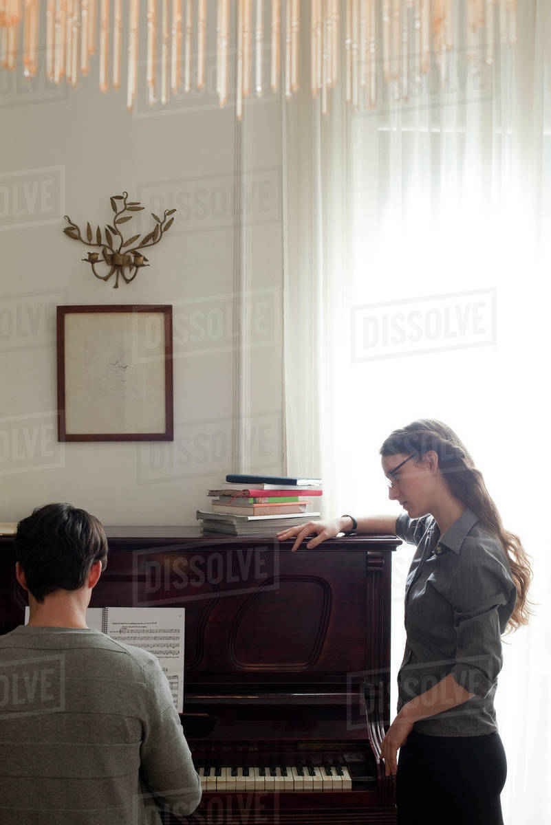 Man taking piano lessons - Royalty-free Stock Photo | Dissolve
