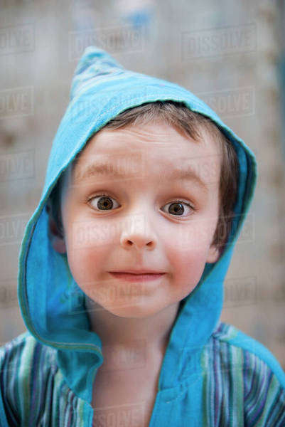 Little boy looking at camera with surprised expression, portrait ...