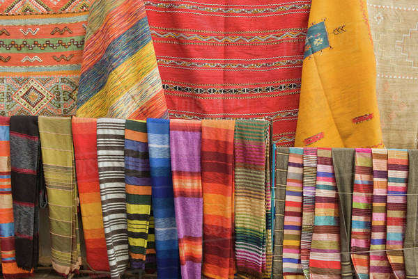 Brightly colored textiles, full frame - Stock Photo - Dissolve