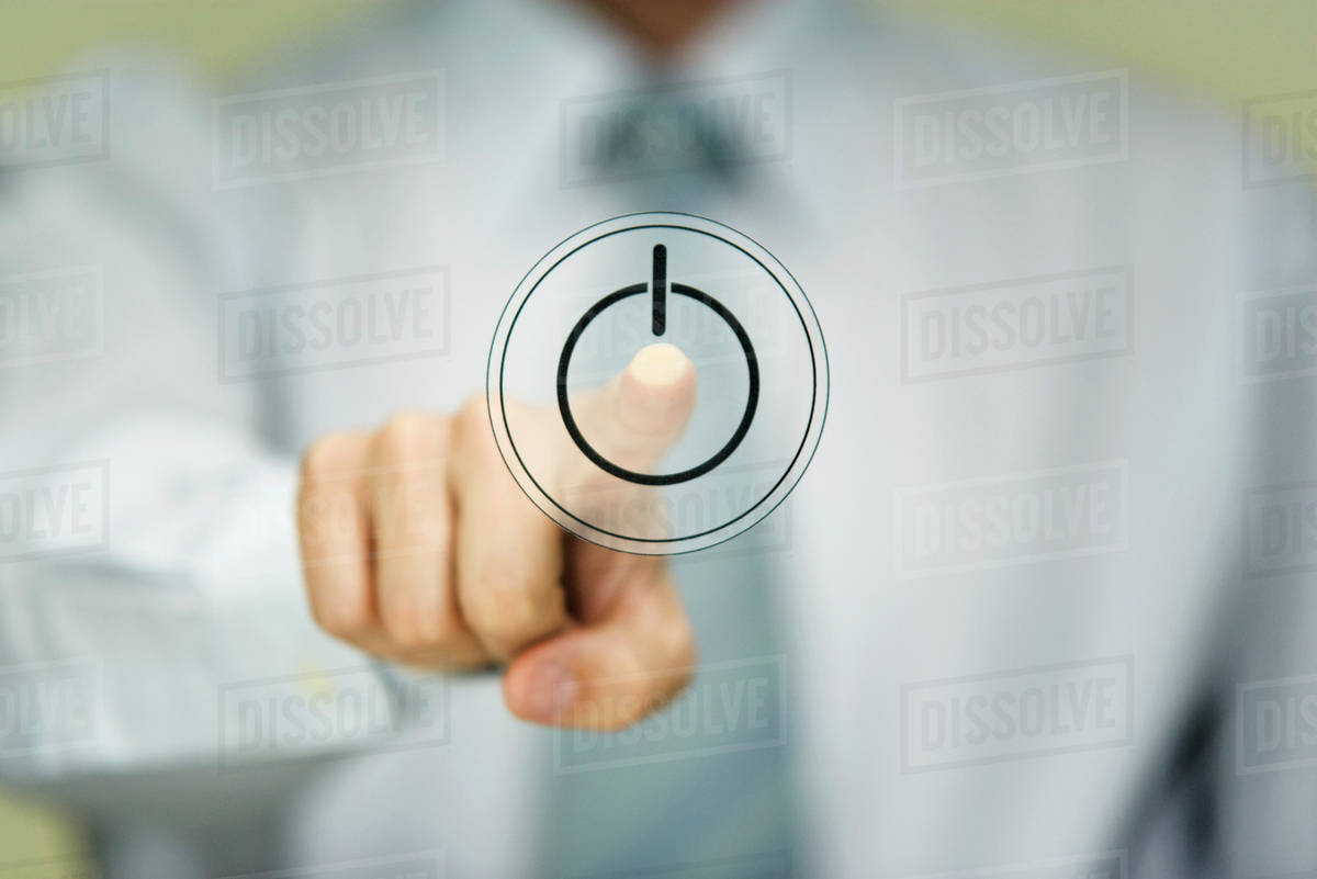 Man pressing power button - Royalty-free Stock Photo | Dissolve