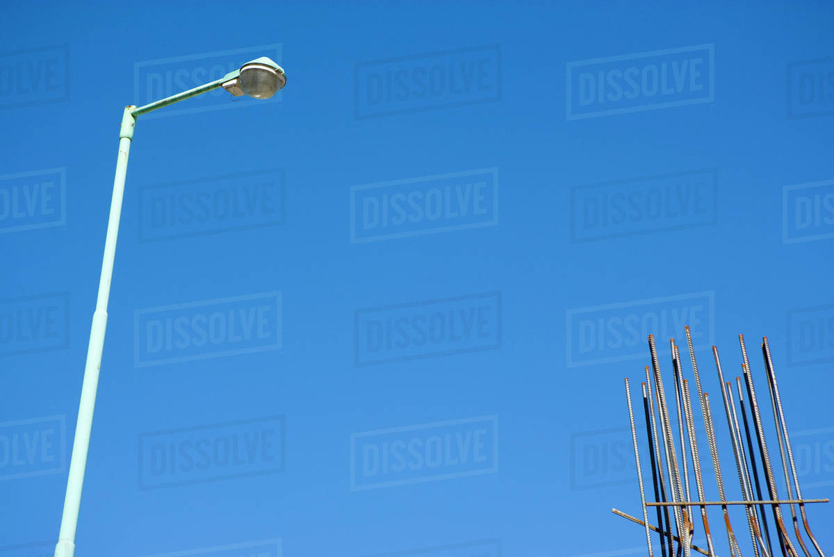 Rebar, street lamp against blue sky, low angle view - Royalty-free ...