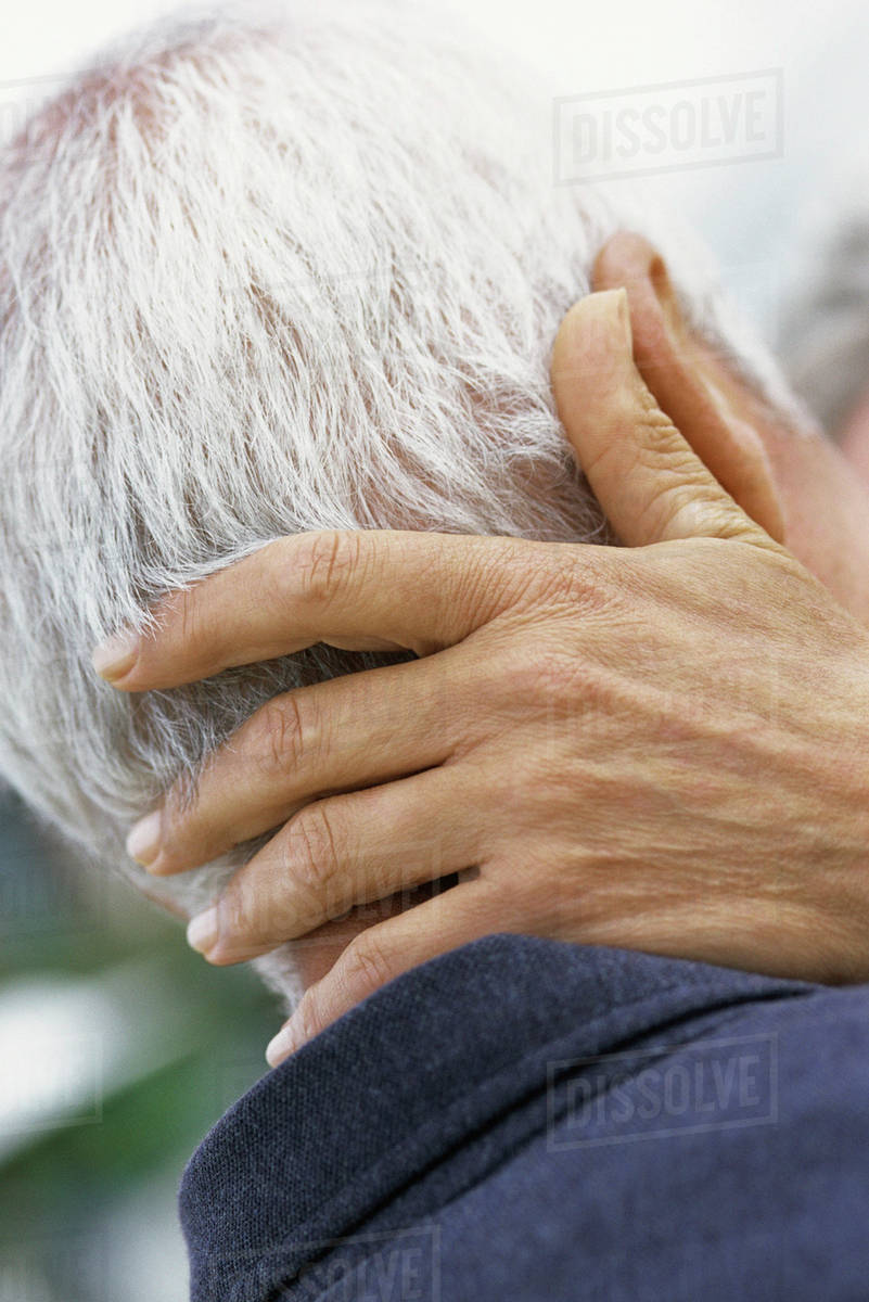 Woman's hand on back of man's neck, close-up - Royalty-free Stock Photo ...