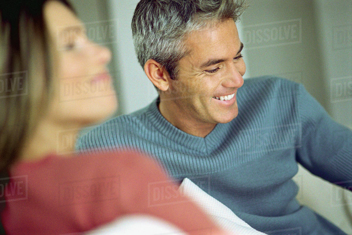 Couple smiling, laughing together, focus on man - Royalty-free Stock ...