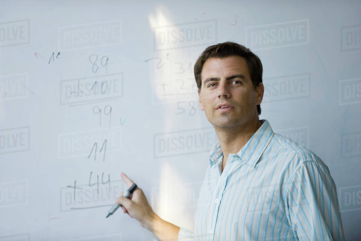 Math teacher pointing to equation on whiteboard - Royalty-free Stock ...