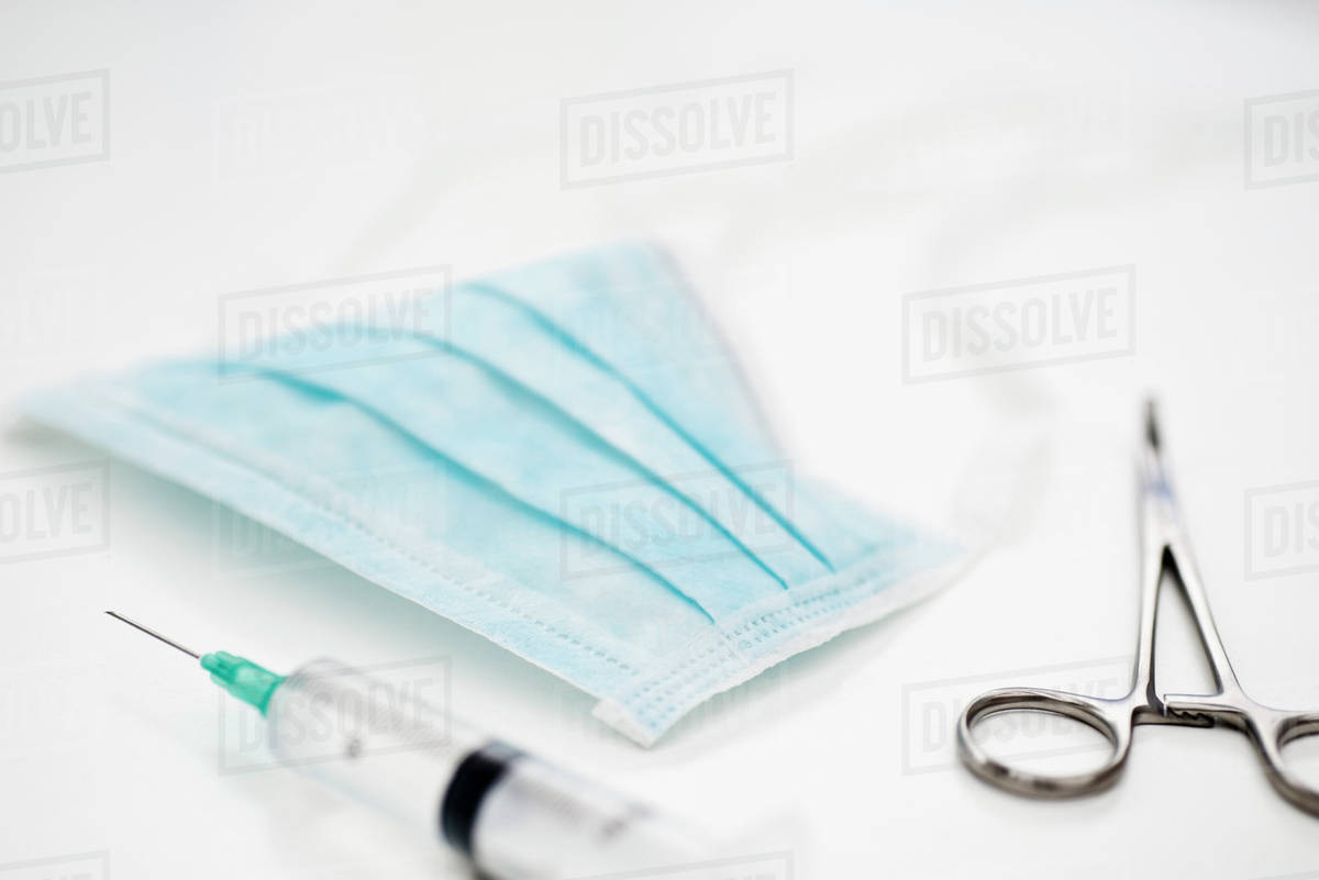 Surgical mask, syringe, forceps - Royalty-free Stock Photo | Dissolve