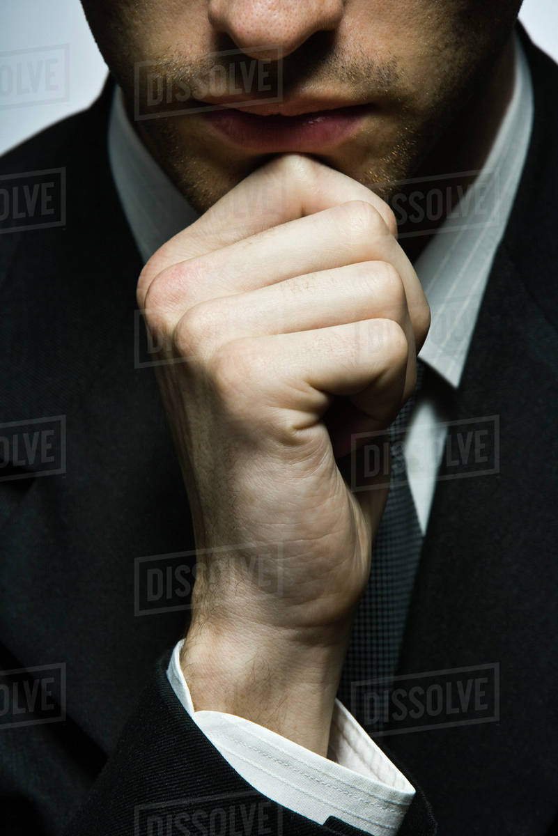 Businessman expressing uncertainty, portrait - Stock Photo - Dissolve