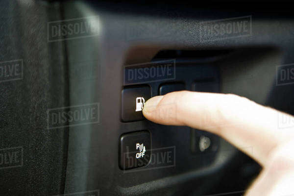 Pressing gas tank button on dashboard keypad - Royalty-free Stock Photo ...