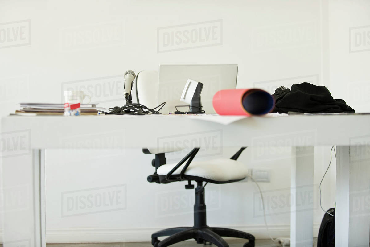 Messy desk - Stock Photo - Dissolve