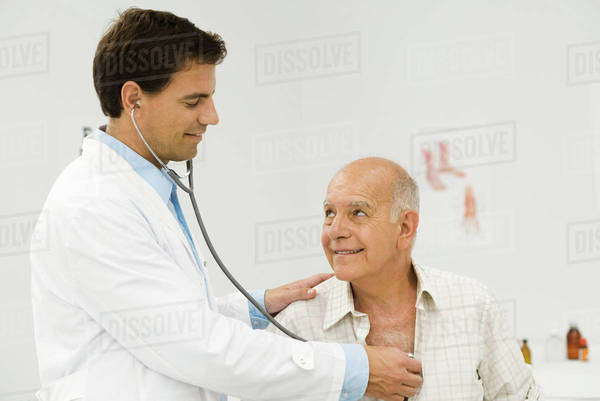 Doctor conducting medical exam - Royalty-free Stock Photo | Dissolve