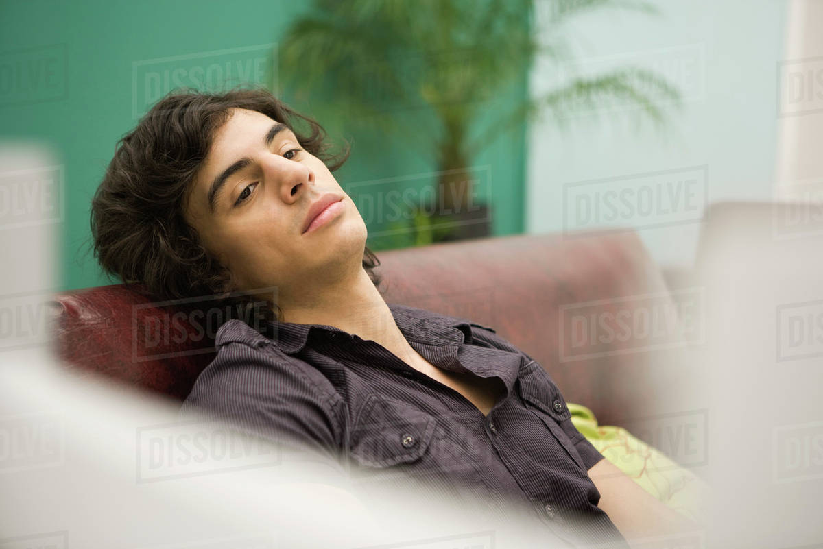Young man daydreaming - Royalty-free Stock Photo | Dissolve