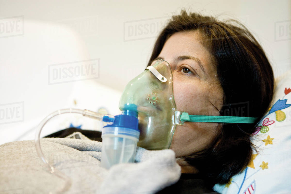 Woman receiving oxygen treatment - Royalty-free Stock Photo | Dissolve