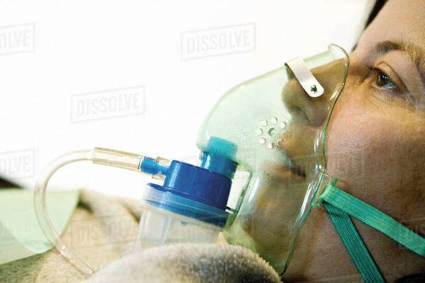 Patient wearing oxygen mask, close-up - Royalty-free Stock Photo | Dissolve