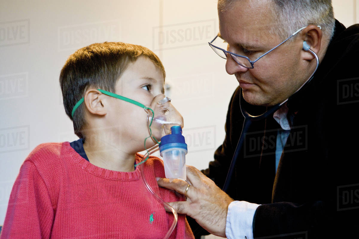 Boy receiving oxygen treatment - Royalty-free Stock Photo | Dissolve