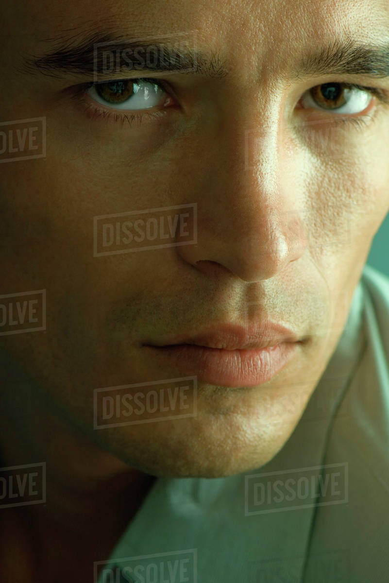 Man glaring at camera, close-up - Stock Photo - Dissolve