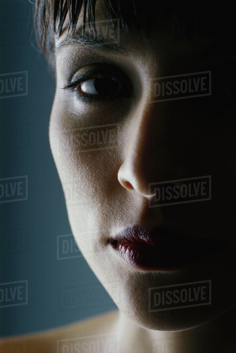 Woman's face in shadow, close-up - Royalty-free Stock Photo | Dissolve