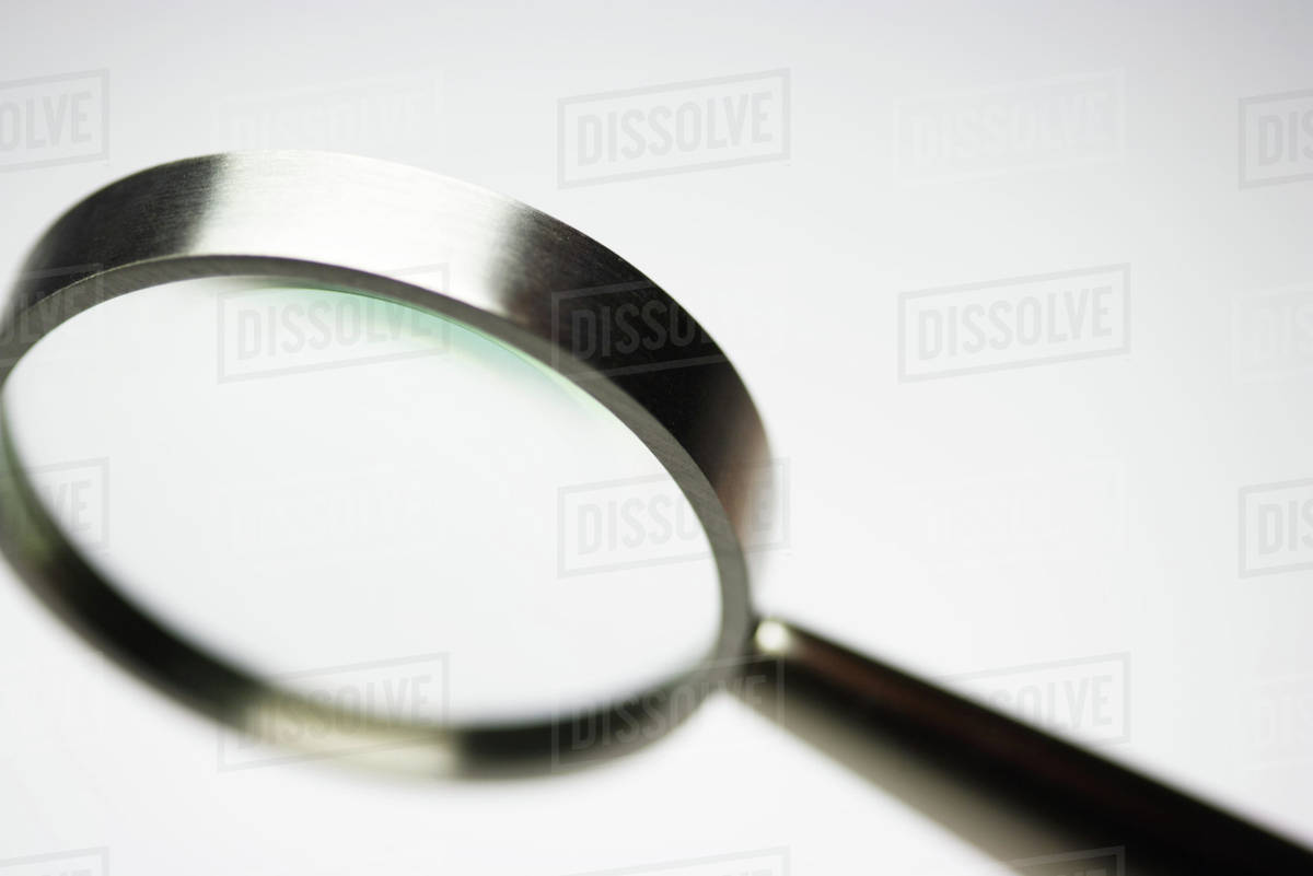 Magnifying glass, close-up - Royalty-free Stock Photo | Dissolve
