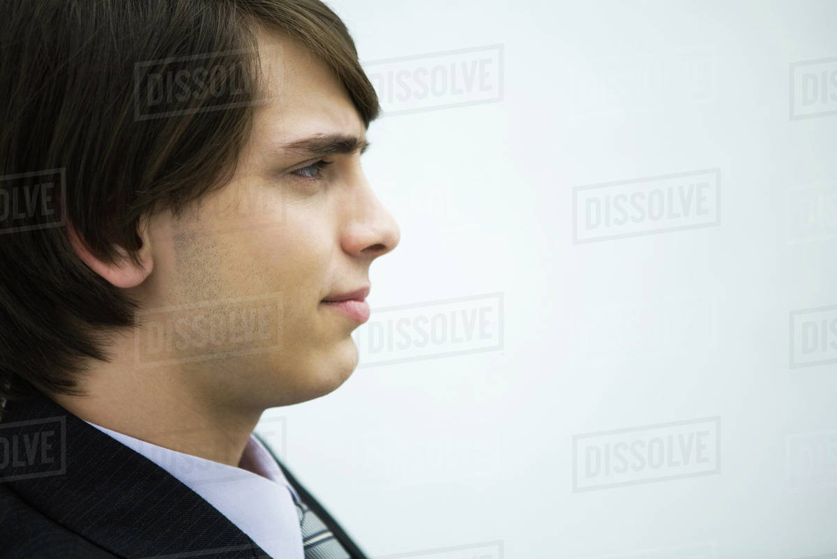 Young man looking away, profile, portrait - Stock Photo - Dissolve