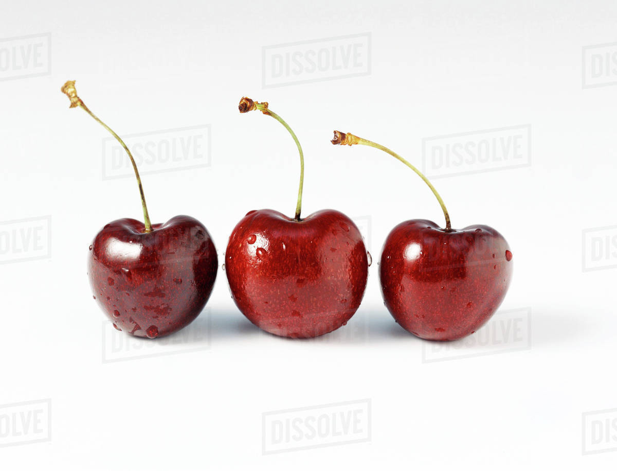 Three fresh cherries, close-up - Royalty-free Stock Photo | Dissolve