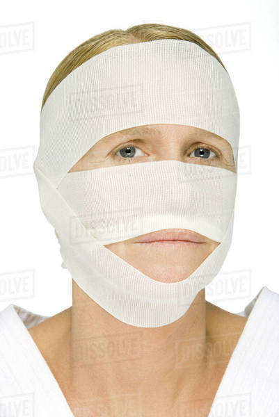 Woman with bandaged face, looking at camera - Royalty-free Stock Photo ...
