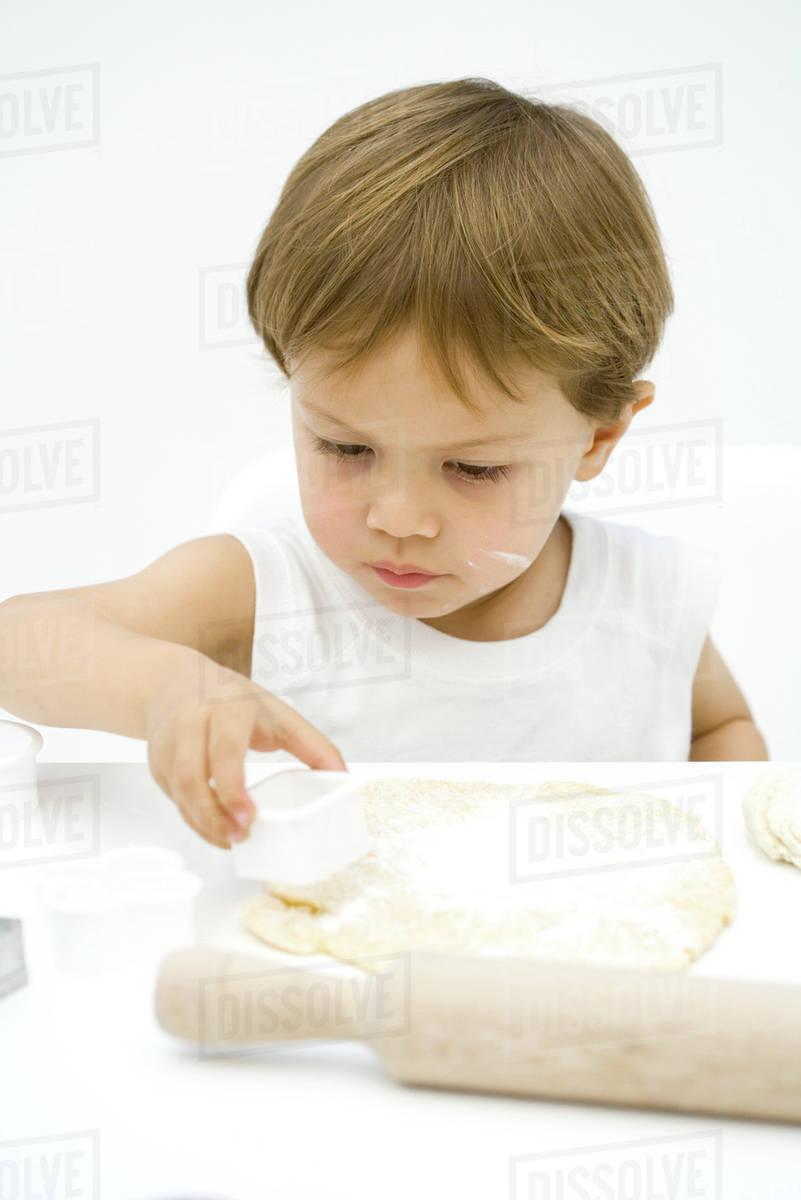 Toddler boy cutting dough with cookie cutter - Royalty-free Stock Photo ...
