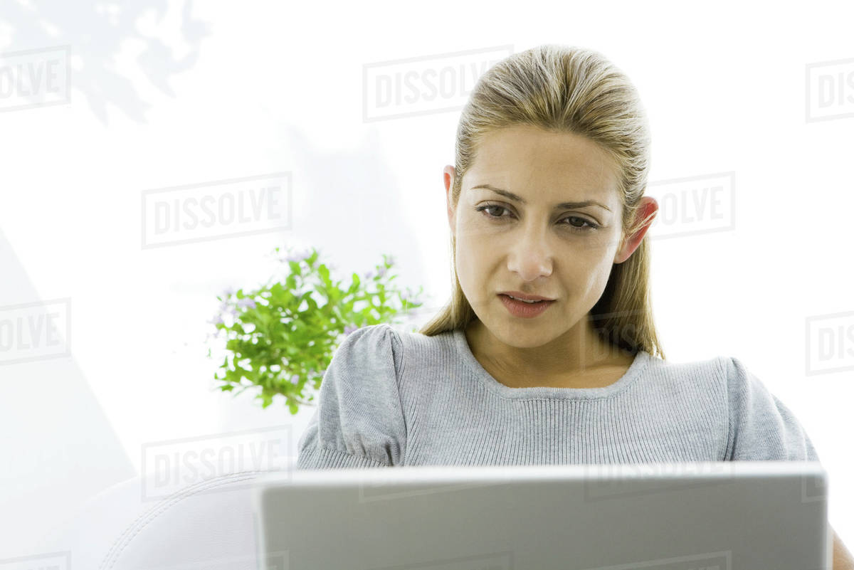 Woman intently looking at laptop, cropped - Royalty-free Stock Photo ...
