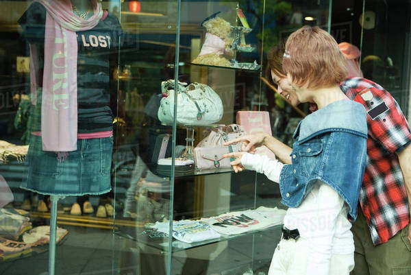 Young couple window shopping - Stock Photo - Dissolve