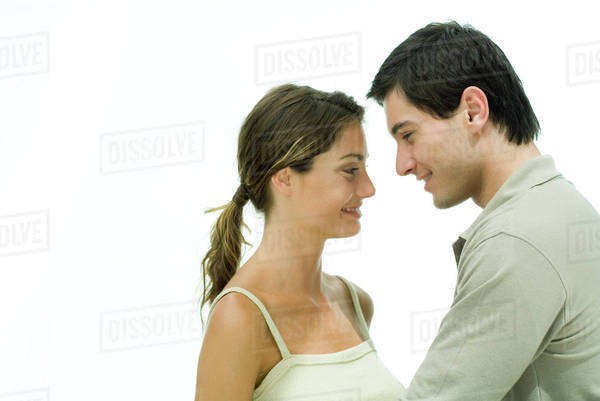 Young couple face to face, smiling at each other, portrait - Royalty ...