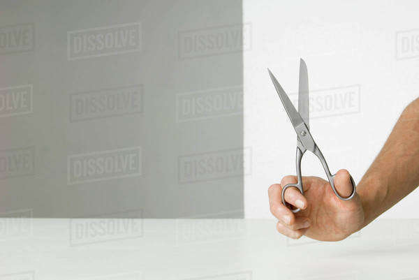 Hand holding scissors - Royalty-free Stock Photo | Dissolve
