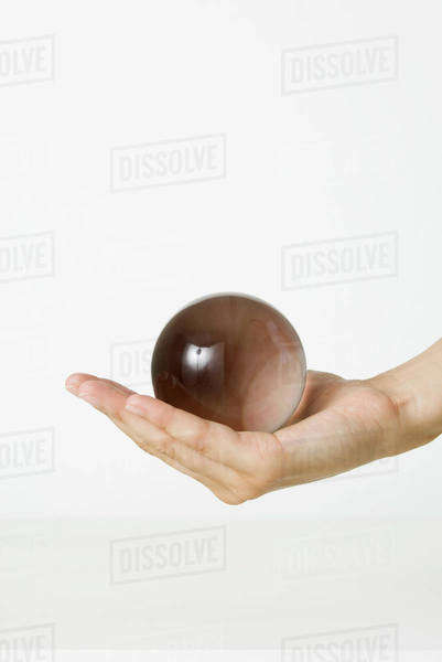 Cupped hand holding crystal ball, cropped view - Royalty-free Stock ...