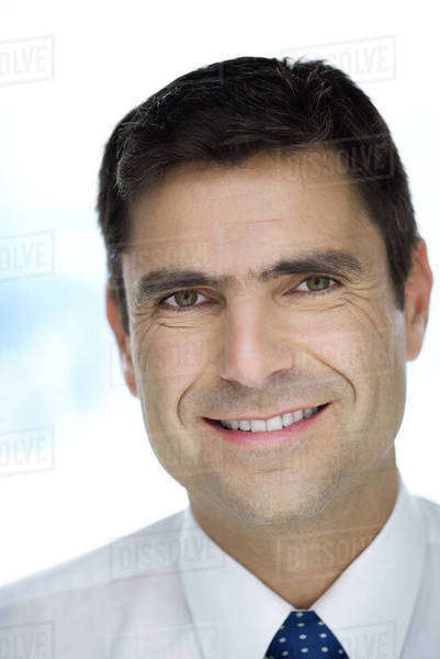 Businessman smiling at camera, portrait - Royalty-free Stock Photo ...