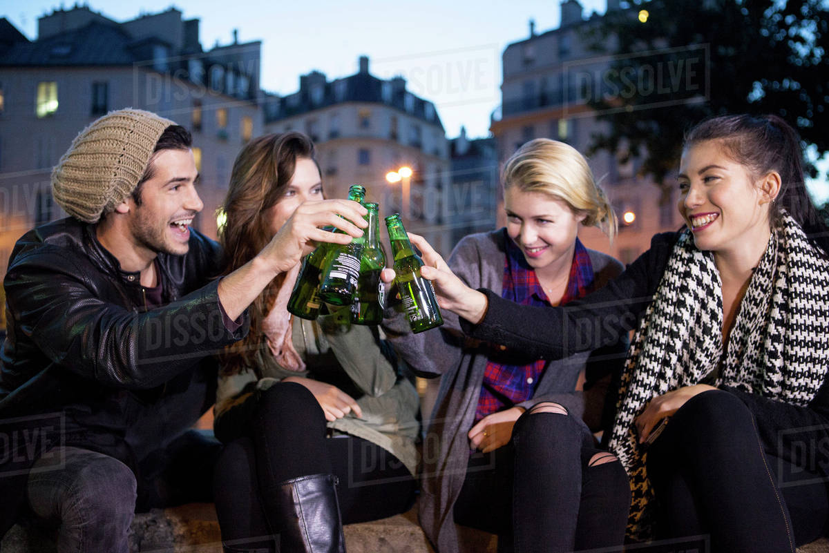 Friends celebrating together outdoors - Royalty-free Stock Photo | Dissolve