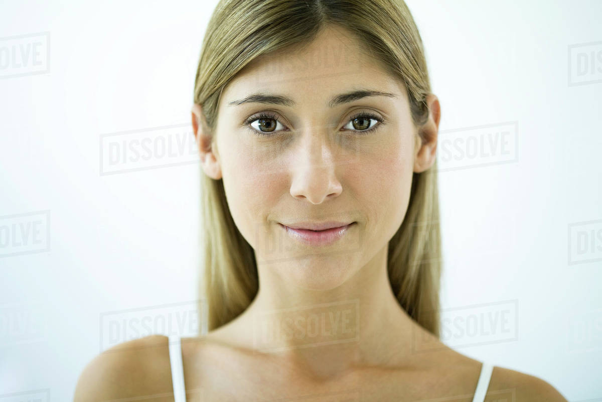 Woman smiling at camera, portrait - Royalty-free Stock Photo | Dissolve
