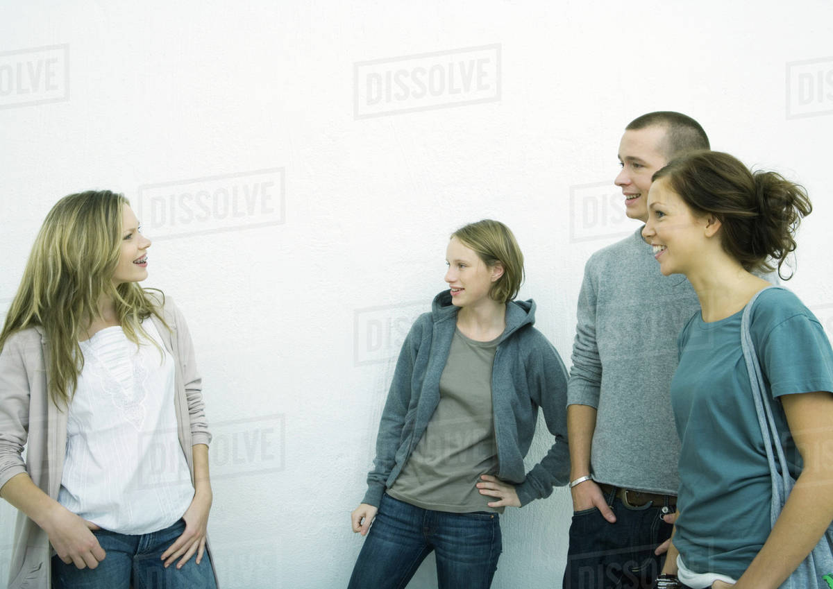Group of young friends, side view - Royalty-free Stock Photo | Dissolve