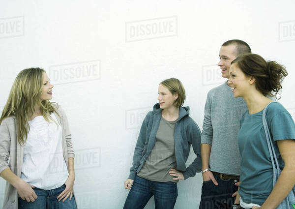 Group of young friends, side view - Royalty-free Stock Photo | Dissolve