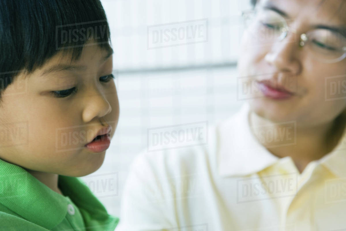 Father and son, boy looking down, man looking at boy - Royalty-free ...