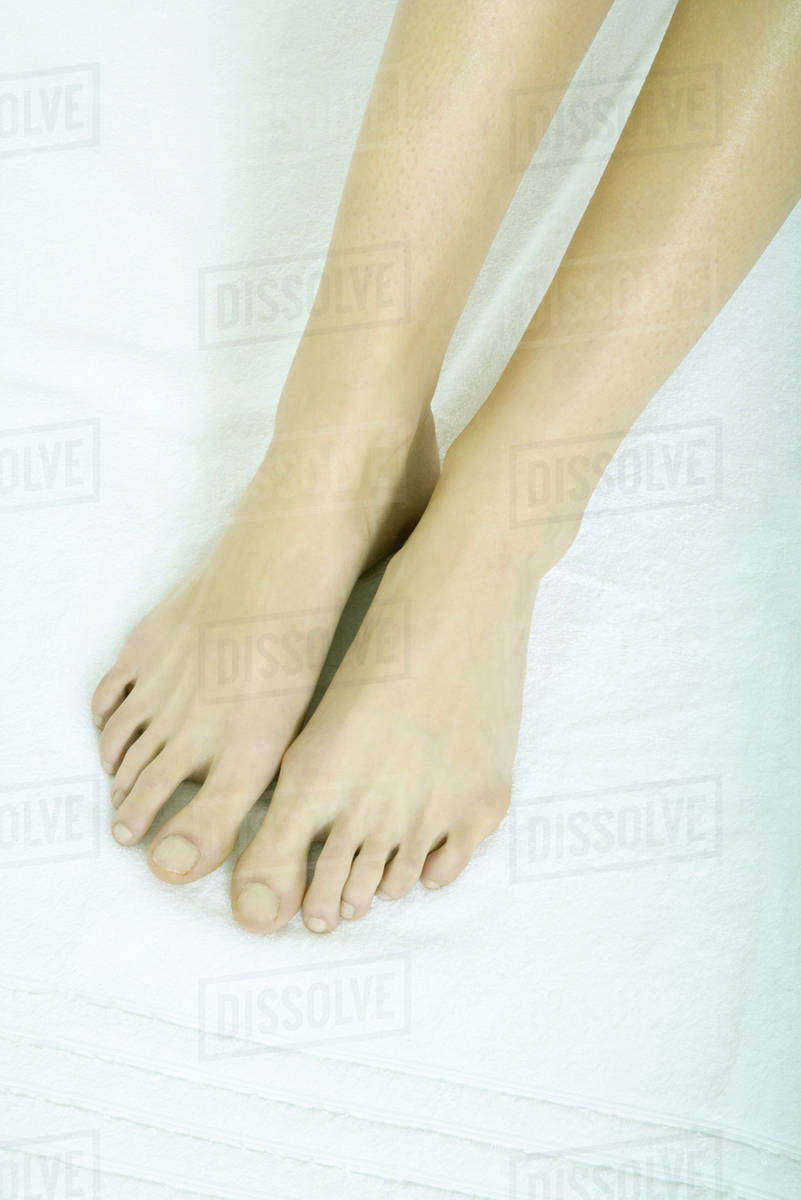 Woman's lower legs and feet, close-up - Royalty-free Stock Photo | Dissolve