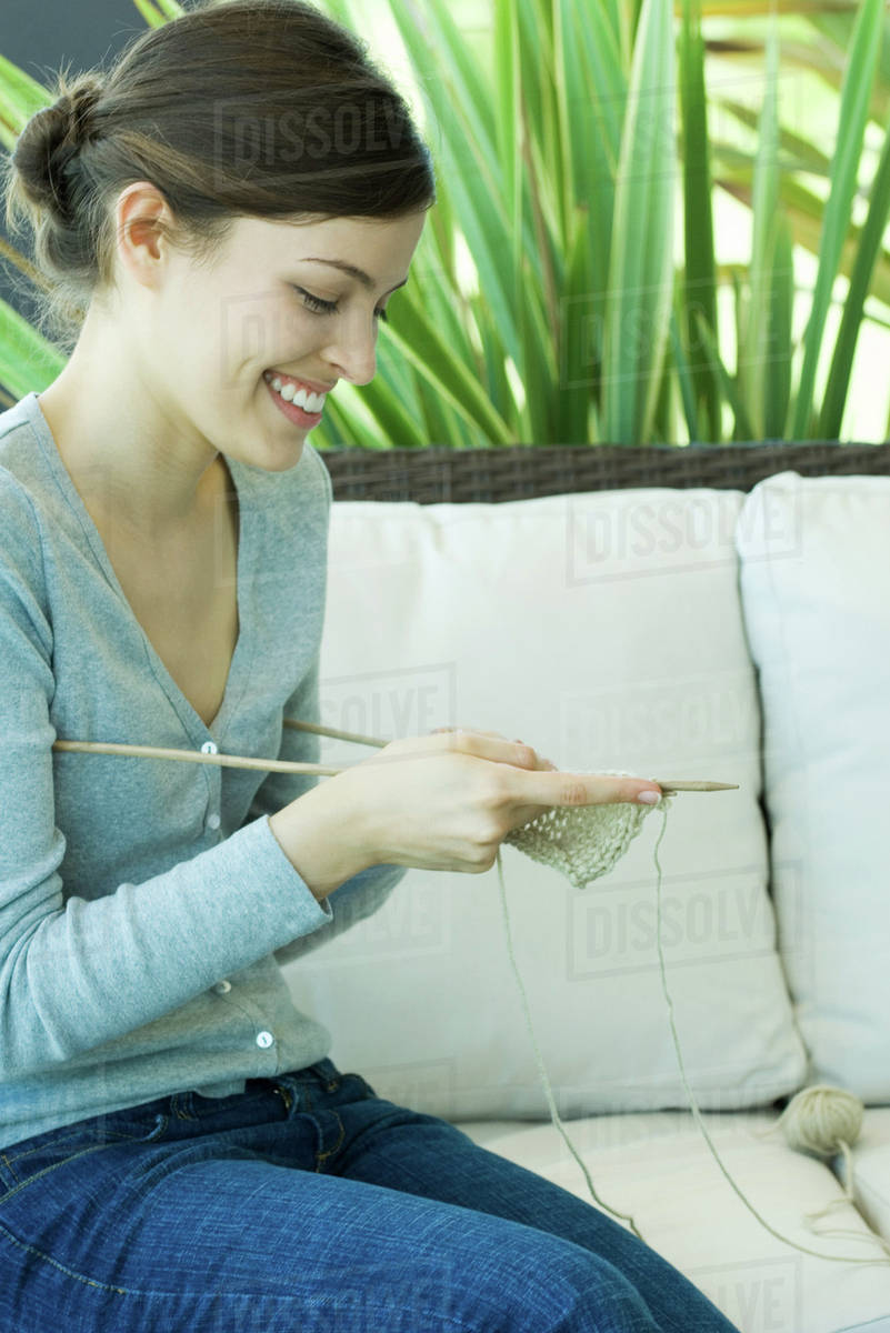 Young woman knitting - Royalty-free Stock Photo | Dissolve