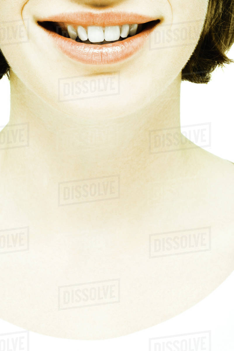 Teenage girl smiling, lower part of face and neck, close-up - Royalty ...