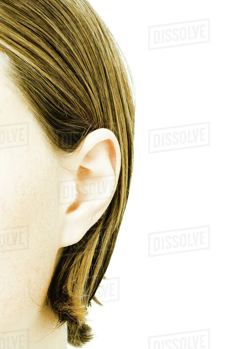 Teenage girl's ear, extreme close-up - Stock Photo - Dissolve