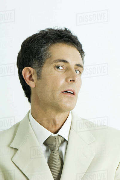 Man, head back, giving sideways look at camera, portrait - Royalty-free ...