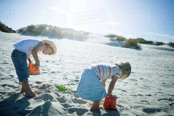 Children playing in sand - Royalty-free Stock Photo | Dissolve