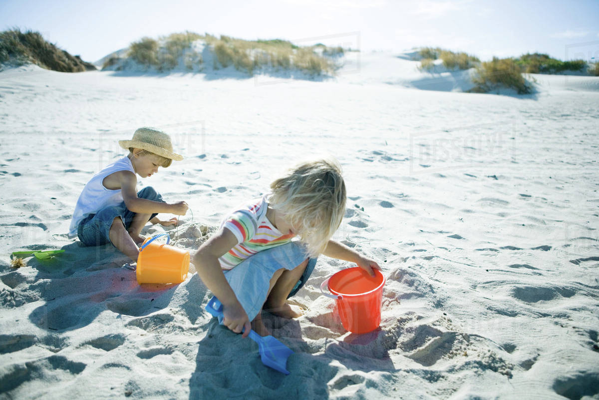Children playing in sand - Royalty-free Stock Photo | Dissolve