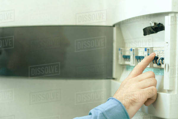 Man switching fuse in fuse box, close-up of hand - Royalty-free Stock ...