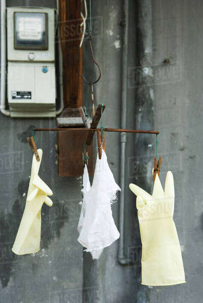 Plastic gloves and rag hanging to dry - Royalty-free Stock Photo | Dissolve